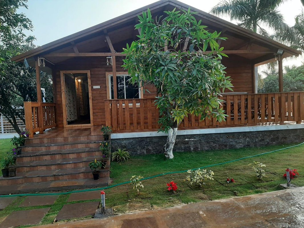 Crafted in wood, surrounded by green - Book Now | YoJo